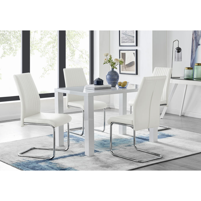 East Urban Home Eubanks High Gloss 4 Seat Rectangular Dining Table Set with Faux Leather ...